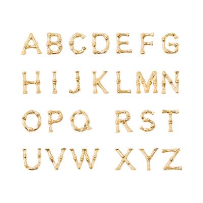 osewaya镀金竹节字母耳夹单只