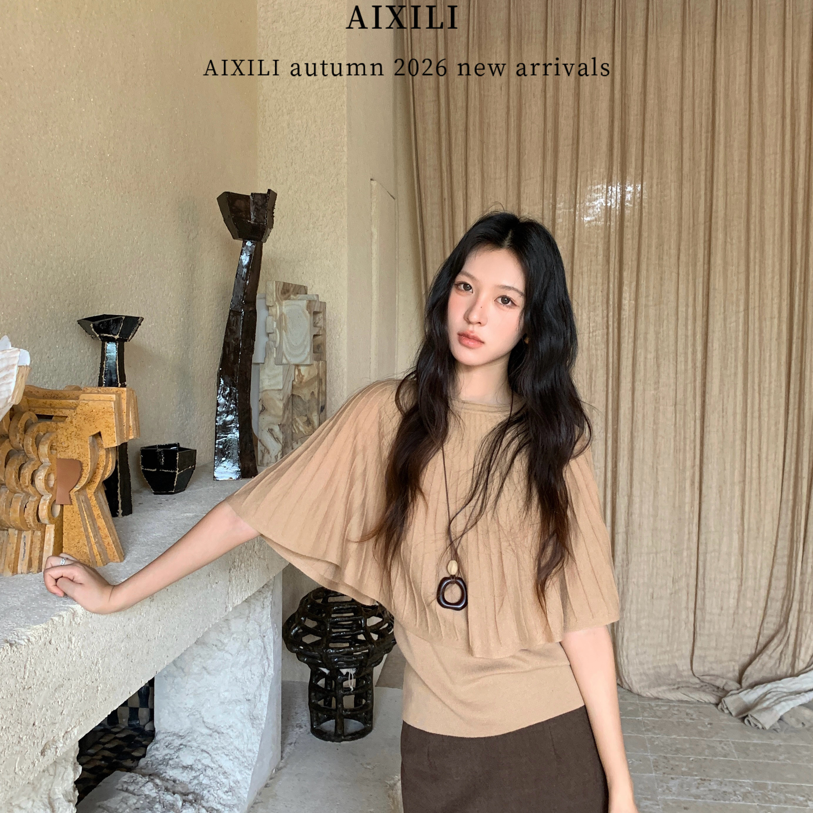 AIXILI爱西里-漫主义斗篷式坑条针织上衣毛衣(含8.8绵羊毛)1750