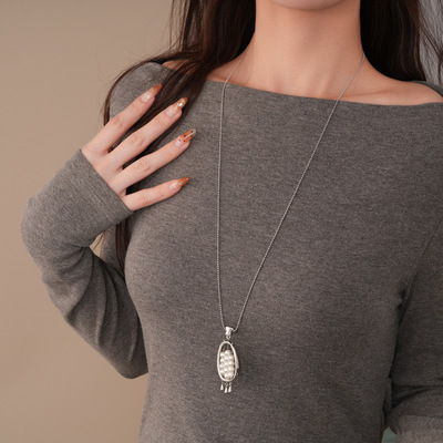 椭圆形镂空水滴流苏珍珠毛衣链