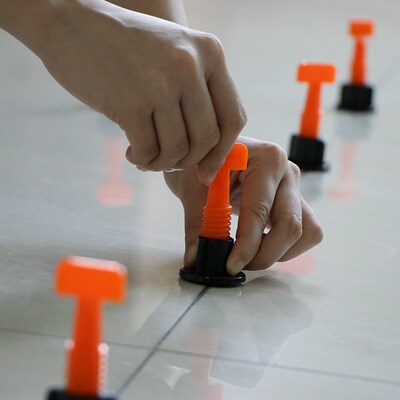 Tile Leveler Adjuster Affixed To The Floor Brick Wall Brick