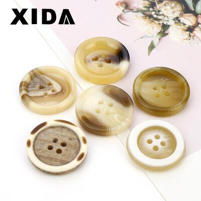 直销新款跨境现货树脂纽扣大衣花纹圆形扣子风衣外套四眼扣永嘉县