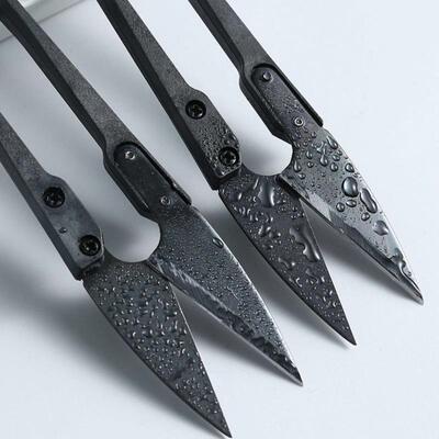Small sharp steel scissors, handcrafted with a spring mechan