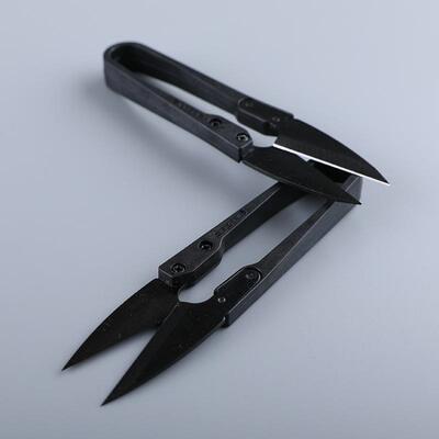Small sharp steel scissors, handcrafted with a spring mechan