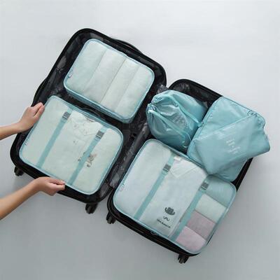 Travel storage bag divided into clothing pocket storage bag