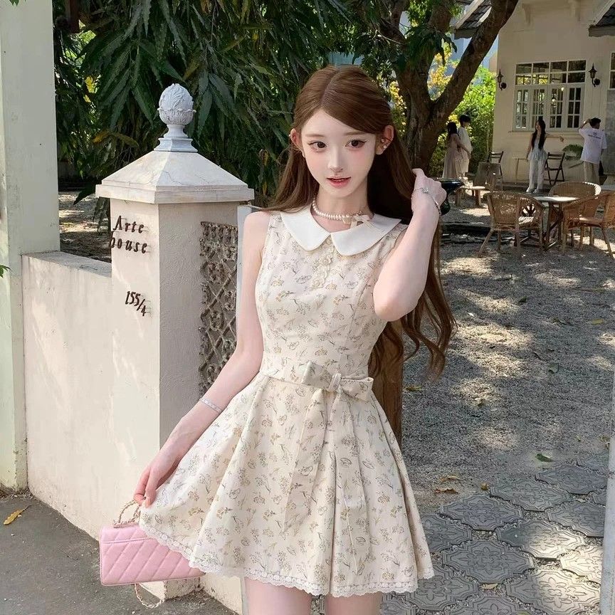 清冷千金风乖巧无袖碎花甜美连衣裙女夏轻奢娃娃领蝴蝶结无袖短裙