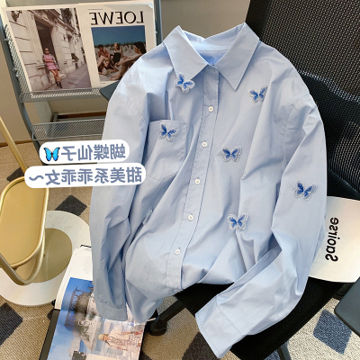 蓝色polo领刺绣蝴蝶结衬衫