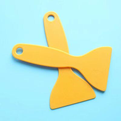 A small cleaning shovel that doesn't damage the floor or gla