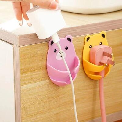 Wall-mounted plug hook with no-drill, traceless adhesive for
