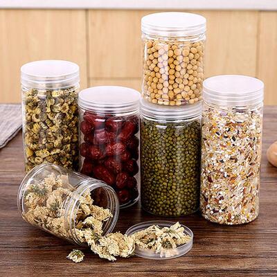 Round lidded plastic jar for storing nuts, grains, and other