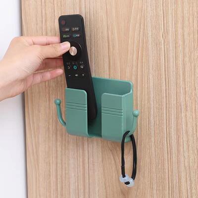 Wall-mounted mobile phone holder, TV and air conditioner rem