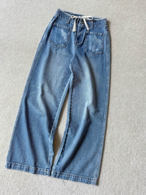 南油绑带牛仔裤