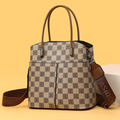 高级感轻奢水桶包2025新款复古手提包小众设计感通勤大容量斜挎包