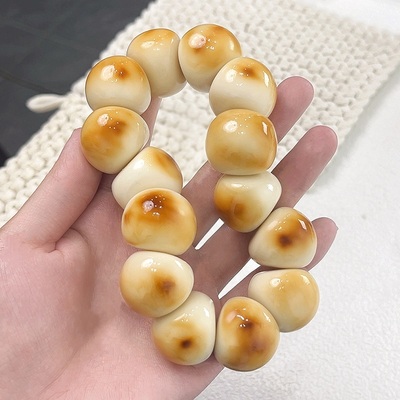 大尺寸炭烧象牙果蒜瓣手串