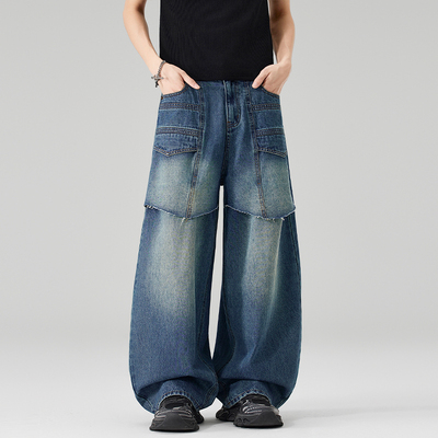 分割不规则毛边假两件弯刀牛仔裤