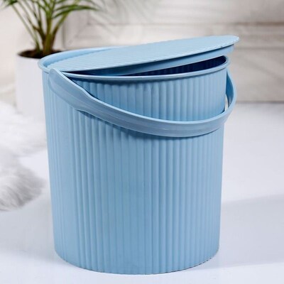 A plastic water bucket with a lid can sit for bathing. A