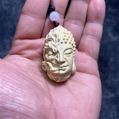 黄杨木一念之间木雕手把件