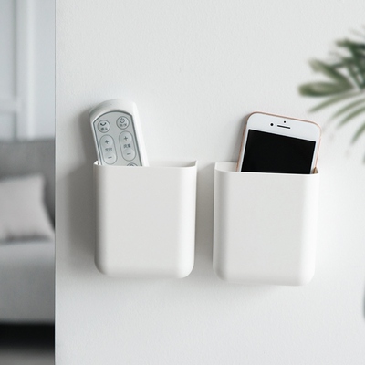 The wall-wall remote in the living room collects a box of wa