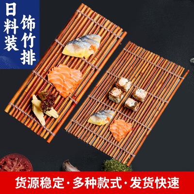 Decorative bamboo skewers with Japanese ingredients, skewers, hand woven bamboo fences, grilled meat and seafood platte