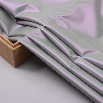 300T高弹春亚纺离型纸珠光金属科技感亮面防寒棉服羽绒棉衣面料