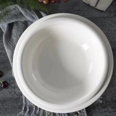 Plain white ceramic salad bowl deep soup plate chopped peppe