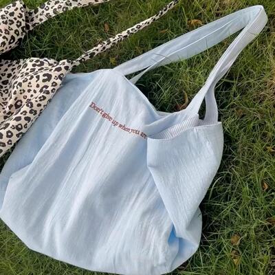 百搭大容量时尚条纹字母单肩包