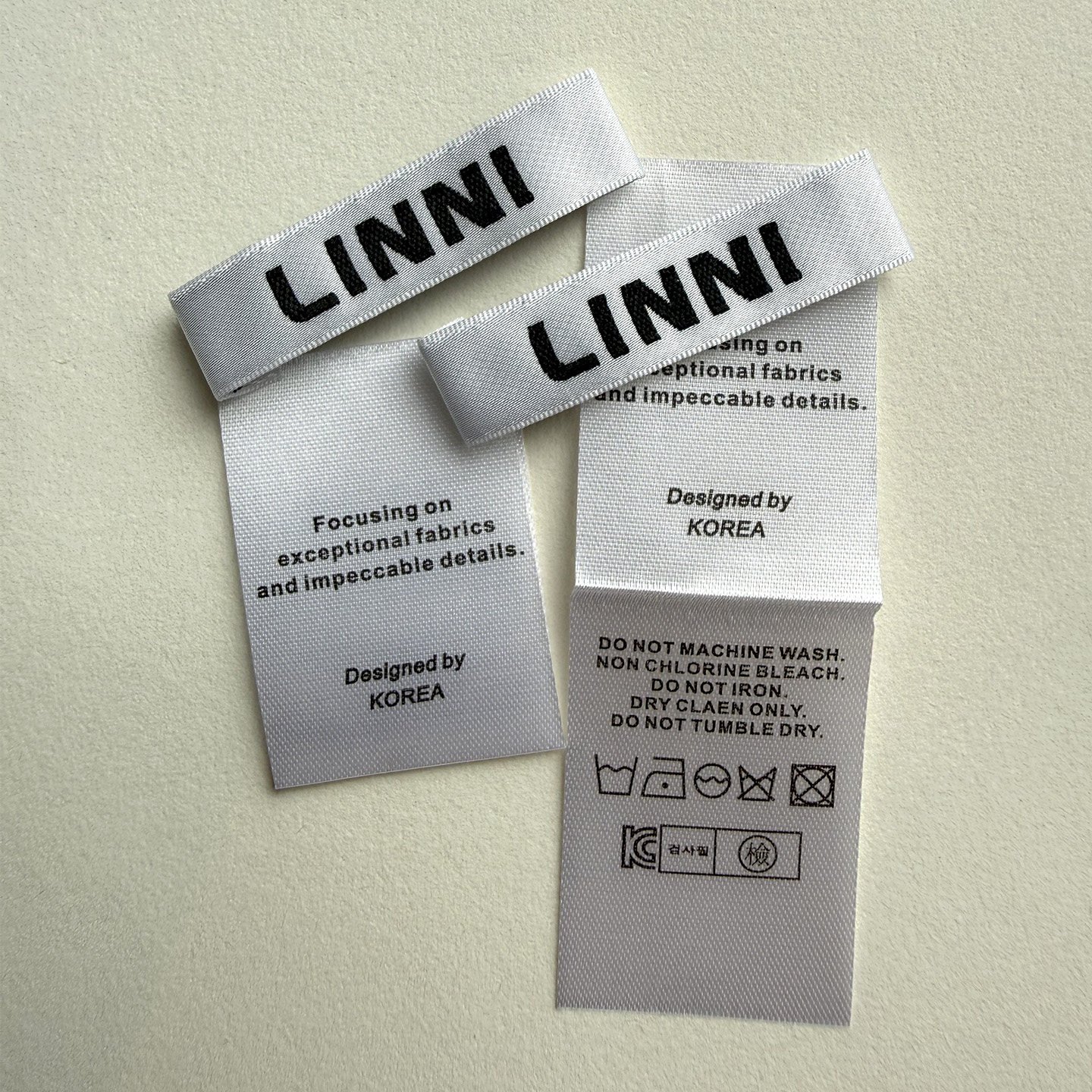 LINNI服装商标洗唛定制布标洗涤标源头工厂高密度唛头订做