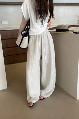 纤贝思1059亚麻白色裤子夏2026新款气球裤速干薄款麻料休闲阔腿裤