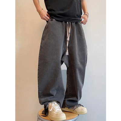 重水洗深灰色毛边掉档牛仔裤