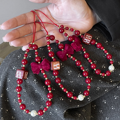 新年红发财蝴蝶结手机链串珠链条手机挂绳ins风挂饰ccd相机拍立得