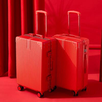 The wedding suitcases are full of red brides dowries with a