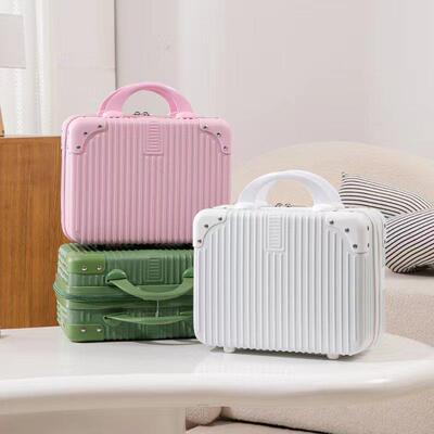 14 inches of small make-up boxes, mini suitcases, bags and s