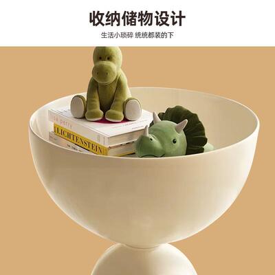 A light-loose bedside cabinet home with a couple of things o