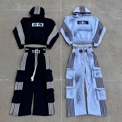 Striped dark hoodie, double-waist sweatpants.