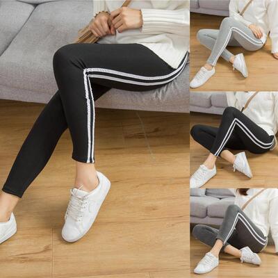 Female student's skinny little leg pants with side stripes