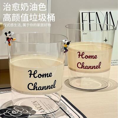 A minimalist and transparent acrylic trash bin, perfect as a