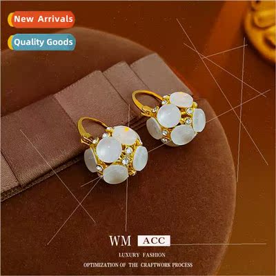 Electroplated cat eye stone round ball hollowed out earrings