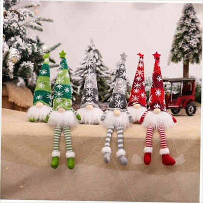 Woven woodman ornaments sit under Christmas lights灯