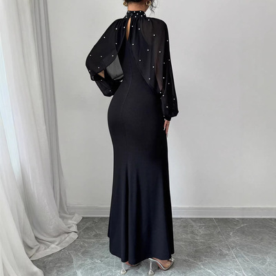 Hot pressed long sleeved waist cinched fish tail long dress