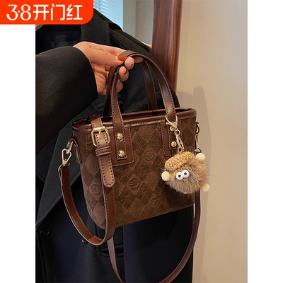 伊布古奇包包女2025新款小众设计春夏季复古百搭斜挎包手提水桶包