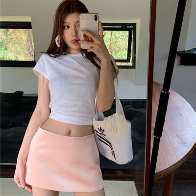 Shes a hot, pink, half-clothed girl with a short ass and a