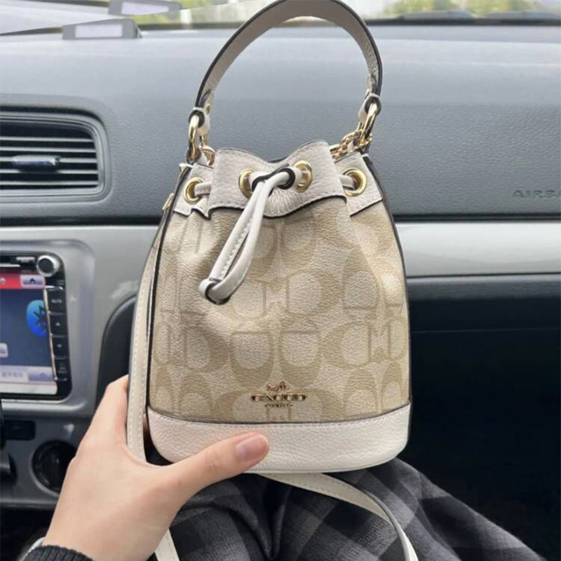 Cocad女士手提斜挎真皮迷你水桶包包