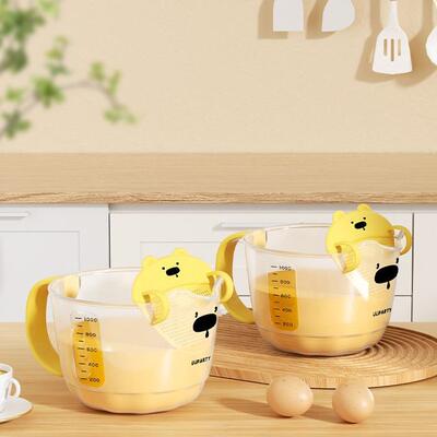 Home-use egg liquid filtering measuring cup with a pouring s