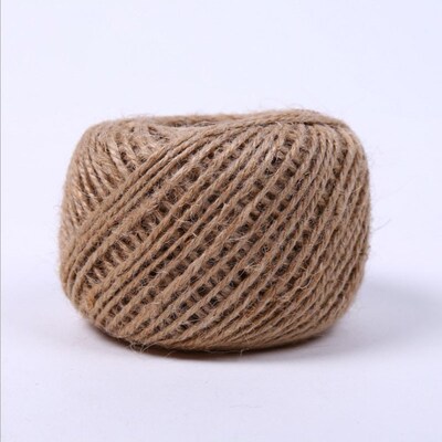 Bake a birthday cake with hemp string around it and wrap a m