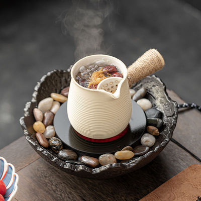 A complete set of electric tea stoves, including electric ceramic stoves, tea pots, and teapots. The electric stove has