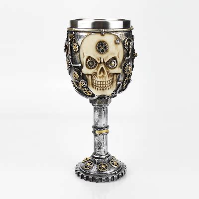 Gothic wine glass contains dragon claw Viking skull retro