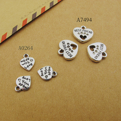 A0264桃心1000克/1666个包0.6克12x10mm古银字母镂空猫爪合金配件