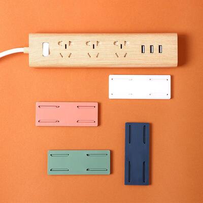 Wall-mounted socket organizer and storage shelf, no drilling