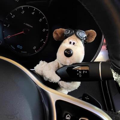 Car interior decorating car with a masked doll hanged on the