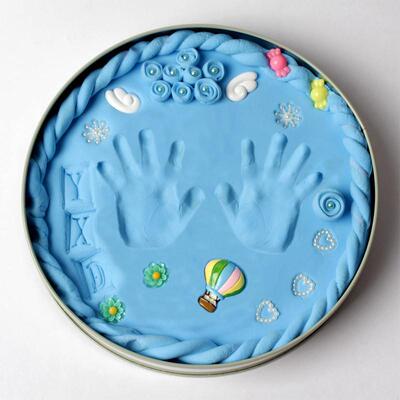 The round iron box babys footprint is covered in mud, and t