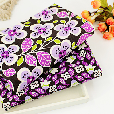 服装黑底紫色清仓甩卖印花布料